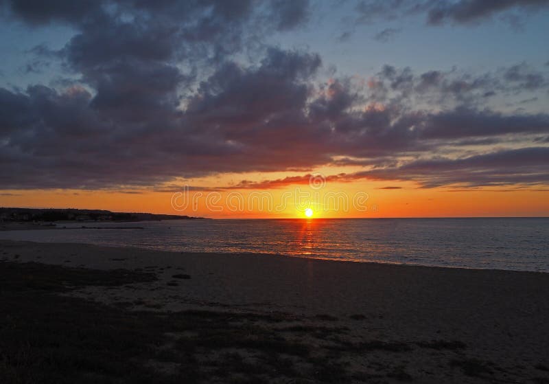 Sunset with the Red Orange Sun Going Down To the Sea on the Sand Stock ...