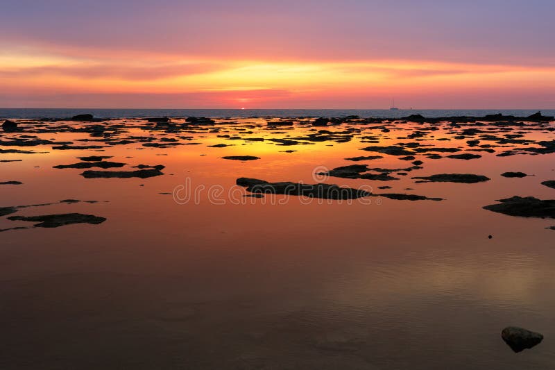 Sunset Reflected Sea Mirror Rocks Emerging Surface Water Stock Photos ...