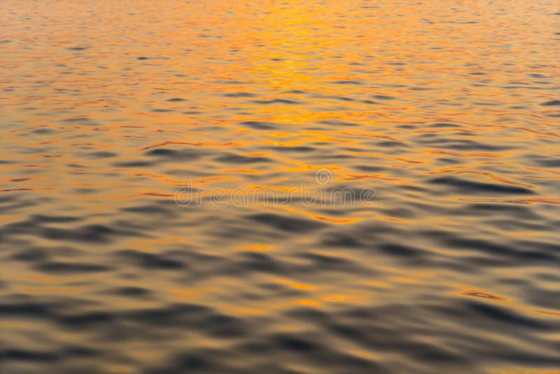 Sunset Reflecting on the Surface of Sea Water Stock Image - Image of ...
