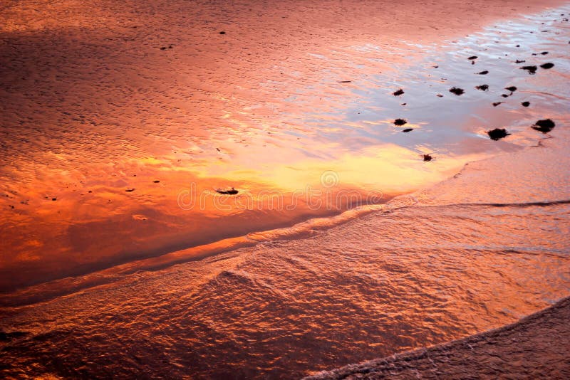 Sunset Reflection on Beach stock image. Image of bray - 102337793