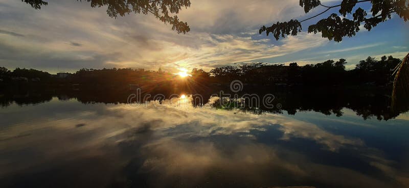 Sunset Reflection on the Lake Stock Photo - Image of reflection, tree ...