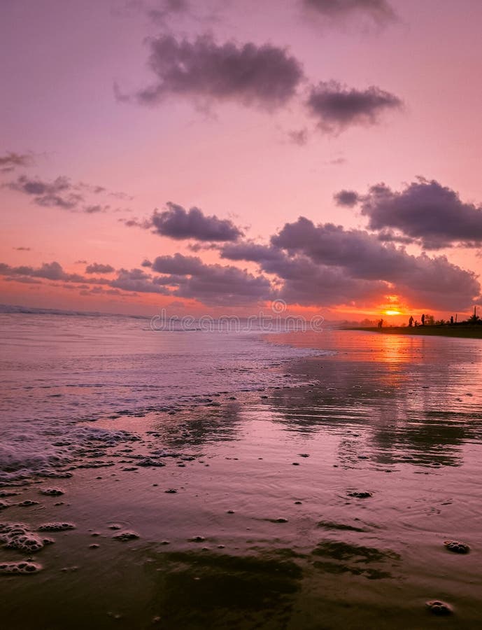 Sunset Reflection of Sunlight on the Beach at Pantai Cemara Sewu ...