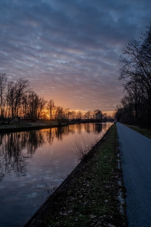 Sunset Reflections on a Calm Canal Path Stock Image - Image of canal ...
