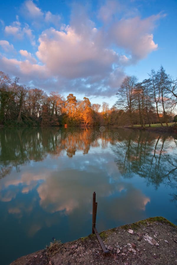 Sunset Reflections at a Rural Lake Stock Image - Image of england ...