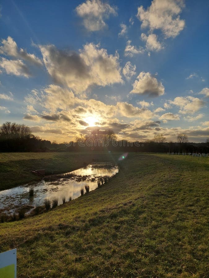 Sunset Reflects in Open Water Showing Off it Clouds Stock Image - Image ...