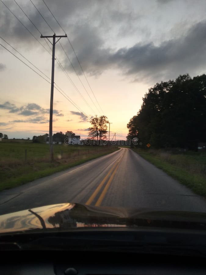 Sunset Rides stock photo. Image of clouds, sunset, rides - 162518454