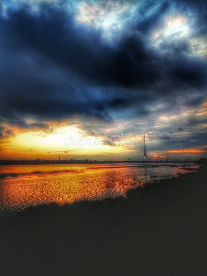 Sunset in Riga, Latvia stock image. Image of sunset - 153761987