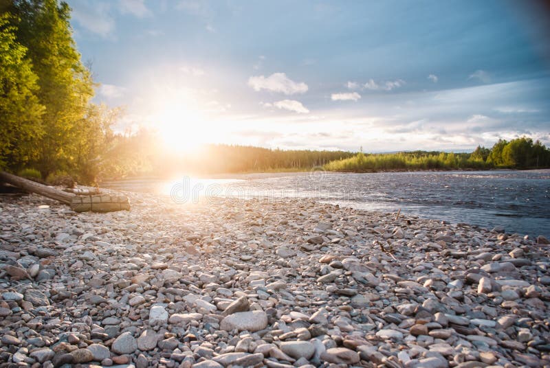 Sunset at the river bank stock photo. Image of evening - 125207670