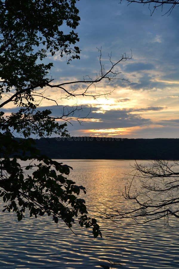 Sunset on the river bank stock image. Image of clouds - 69281775