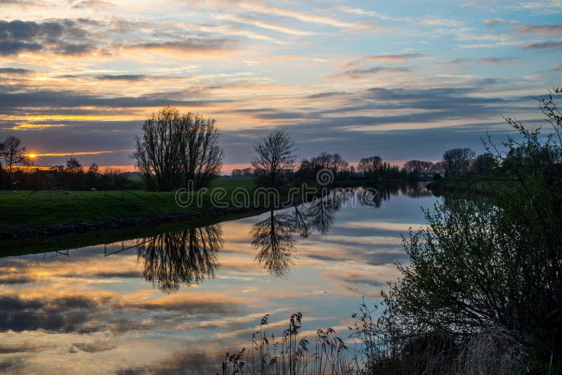 Sunset on the river stock photo. Image of river, skies - 43934232