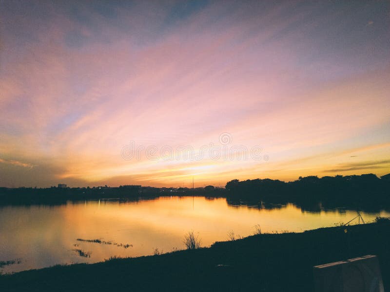 Sunset of river stock photo. Image of river, sunset - 147362220