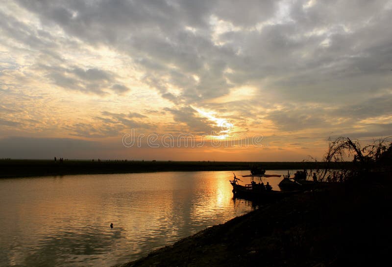 Sunset stock photo. Image of boat, padma, sunset, river - 143708260