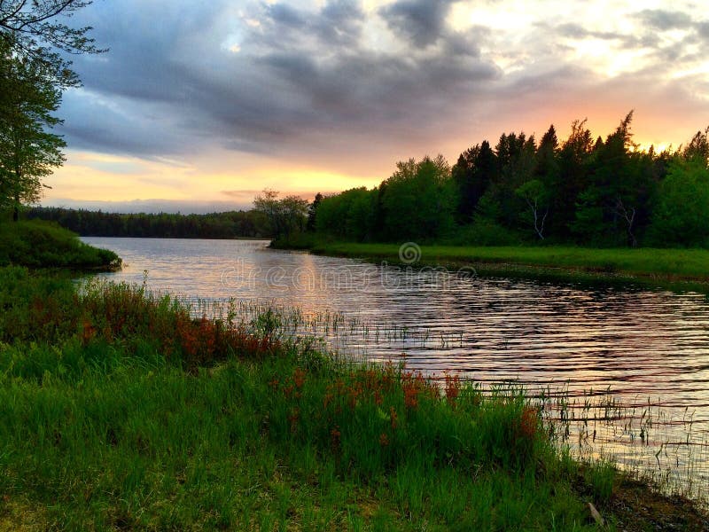 Sunset River stock image. Image of clouds, springtime - 108825361