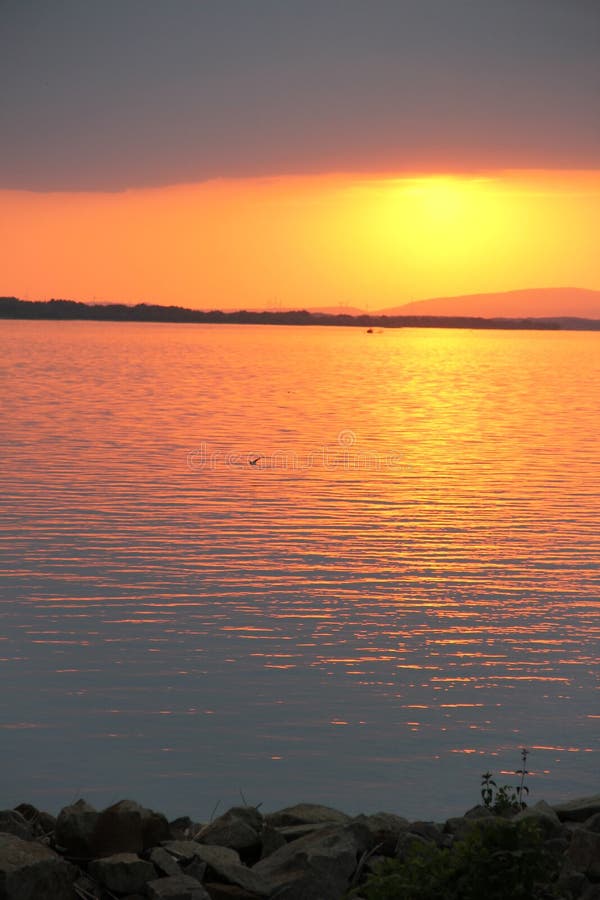 Sunset on the river stock photo. Image of afterglow - 267572904