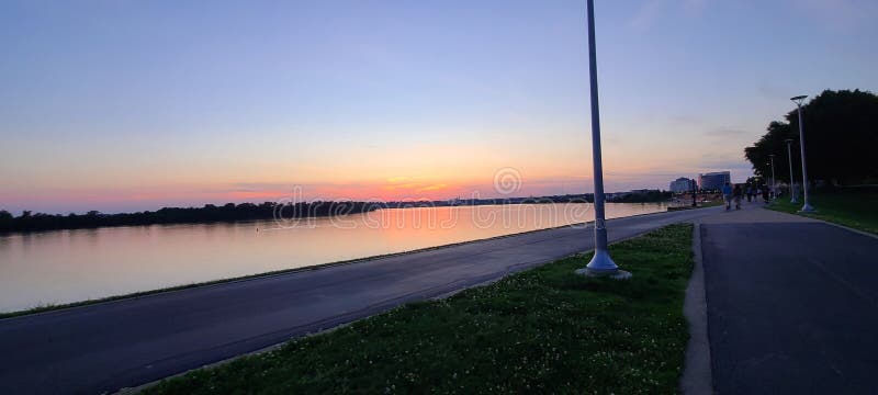 Sunset on the Riverfront stock photo. Image of sunlight - 261530938