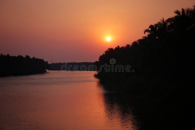 Sunset in the riverside stock photo. Image of riverside - 153603662