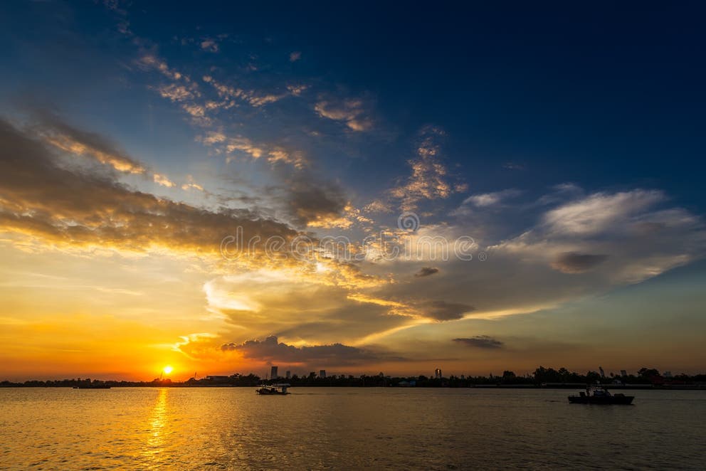 Sunset at riverside stock photo. Image of scenic, cloudscape - 103018200