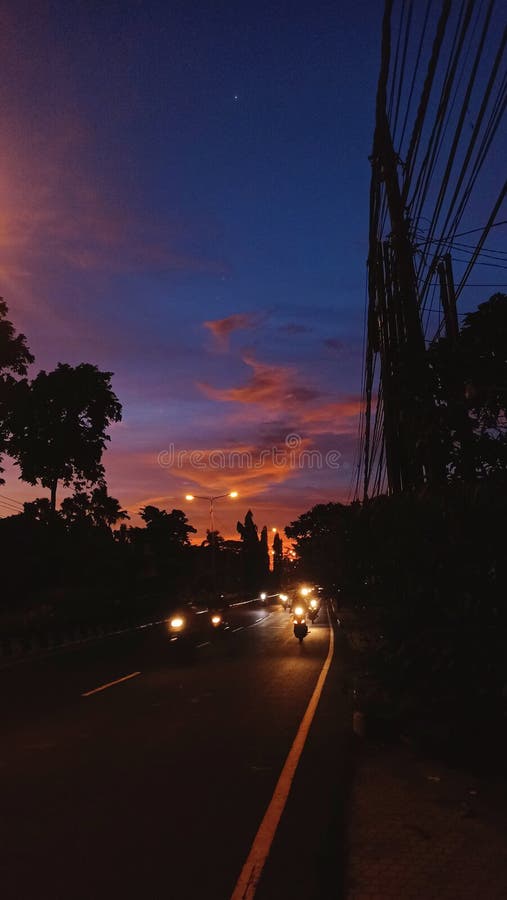 Sunset in the Road at Denpasar, Bali Stock Photo - Image of sunset ...