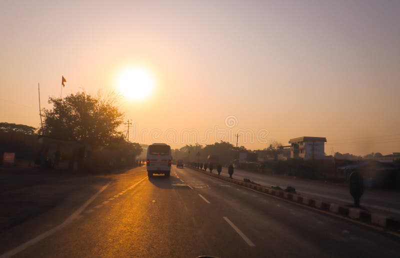 Sunset on the Road Side and the Sun S Rays Falling on the Car Stock ...