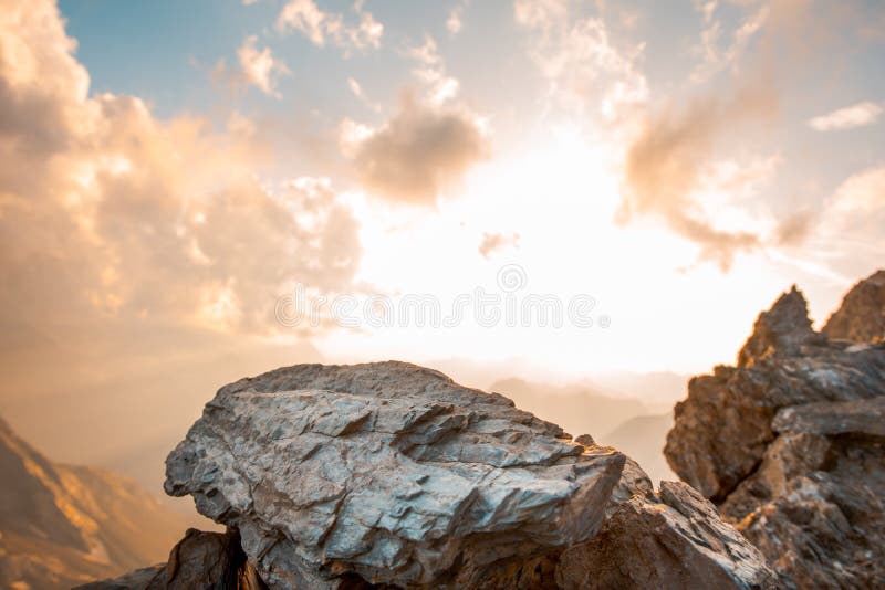 Sunset between Rocks and Clouds in the Mountains. Mountain Lands Stock ...