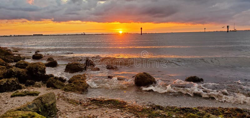 Sunset on the rocks stock image. Image of ocean, beach - 239863865