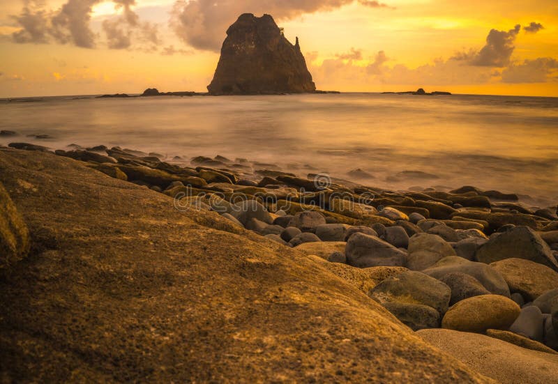 Sunset at the Rocky Beach in Papuma, Jember, East Java, Indonesia Stock ...