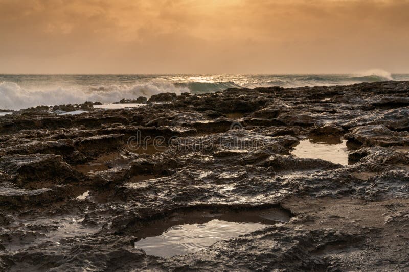 Sunset at the Rocky Beach of Pozzallo Stock Image - Image of golden ...