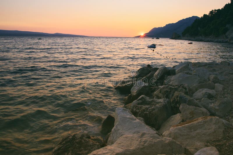 Sunset Rocky Coastline stock photo. Image of rocky, yellow - 62413926