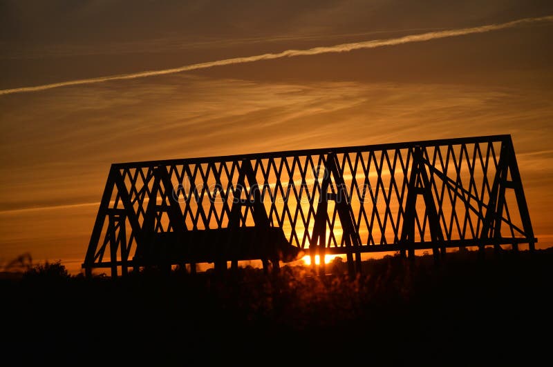 Sunset and roof trusses stock photo. Image of sunset - 82105828