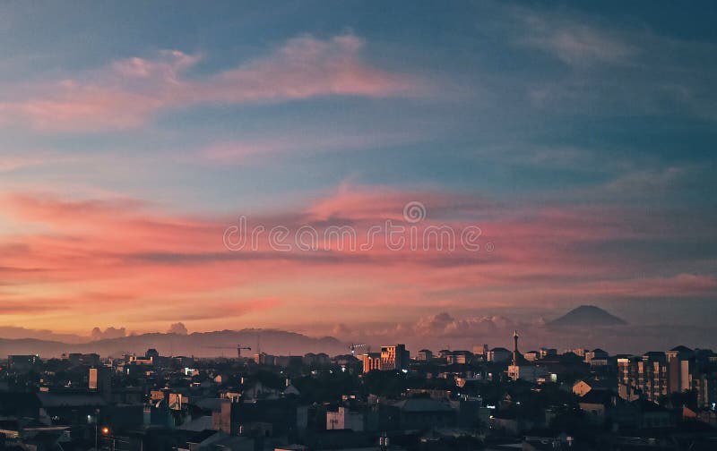 Sunset from the Rooftop Building with View of Mountain Stock Photo ...