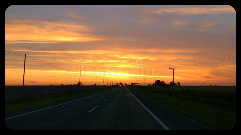 Sunset in the route stock photo. Image of yellow, atardecer - 158694192