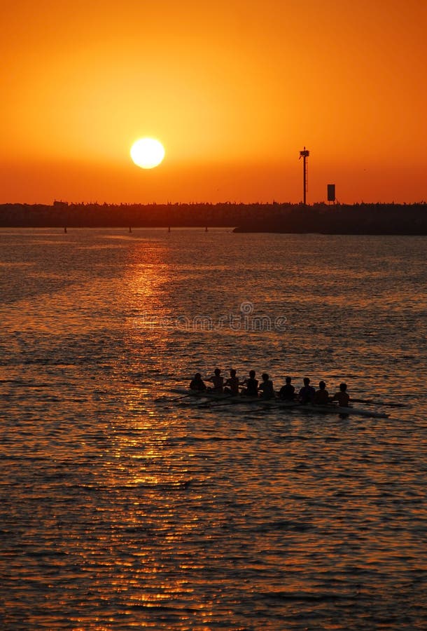 Sunset Rowing Crew stock photo. Image of twilight, team - 4586910