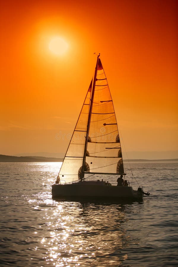 Sailing into the sunset stock photo. Image of dusk, burning - 14806832