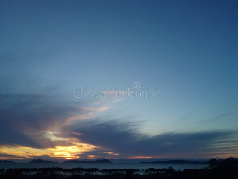 Sunset in samil beach stock photo. Image of cies, orange - 72268730
