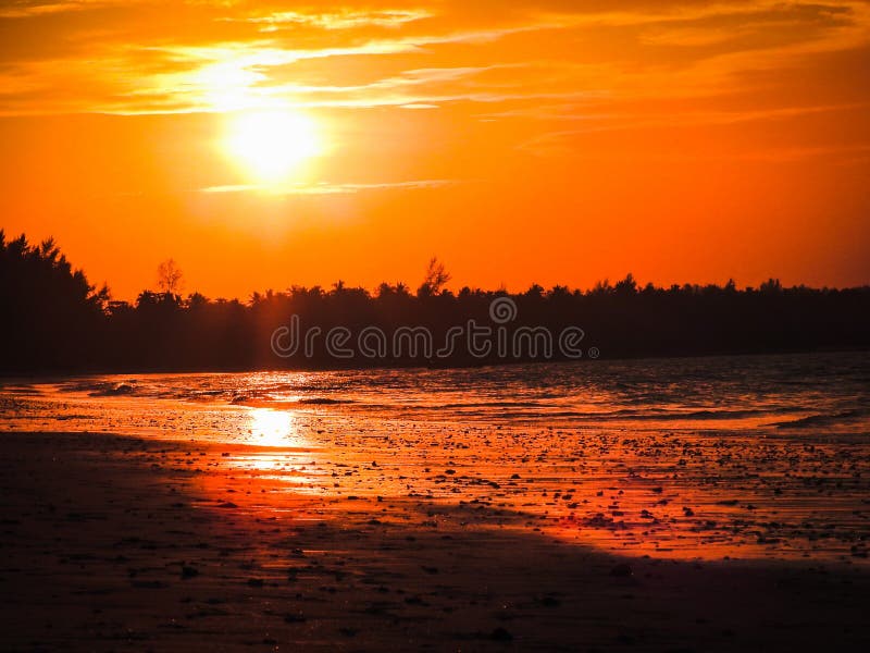 Sunset on the sandy beach stock image. Image of beautiful - 107444595