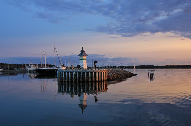 Small Lighthouse and Sailing Boats at Sunset. Editorial Image - Image ...