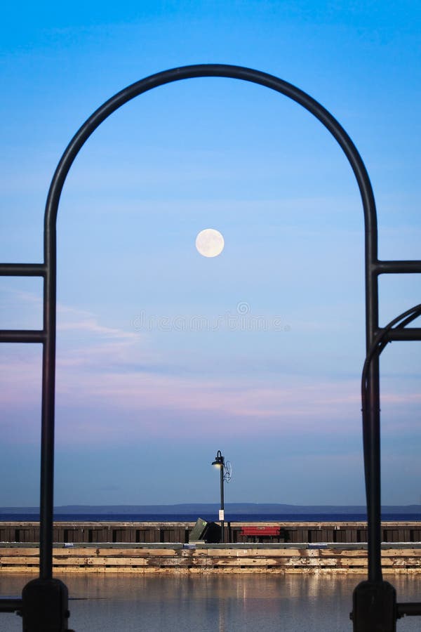 Sunset Scene Of The Moon Over The Marina Dock At Cold Lake, Alberta ...