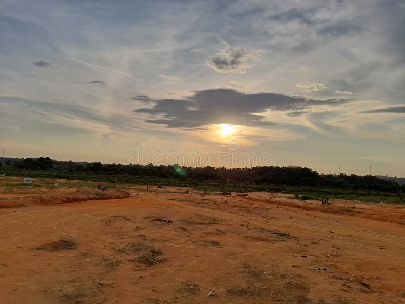 Sunset Scenery in the Red Field Construction Stock Image - Image of ...