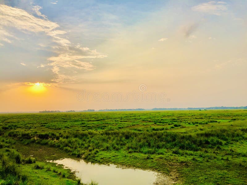 A Sunset Scenery with River and Field Stock Image - Image of cloud ...