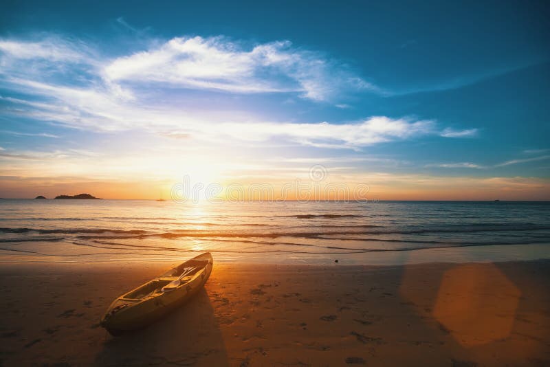 Canoe on the Ocean Beach during the Amazing Sunset. Stock Photo - Image ...