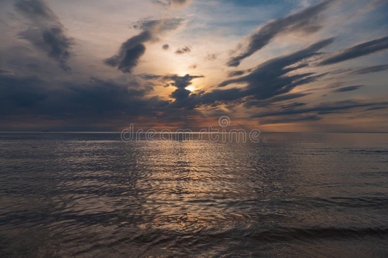 Sunset In The Sea With Clouds And Calm Water Stock Image - Image of ...