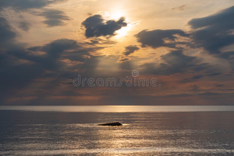 Sunset in the Sea with Clouds and Calm Water Stock Image - Image of ...