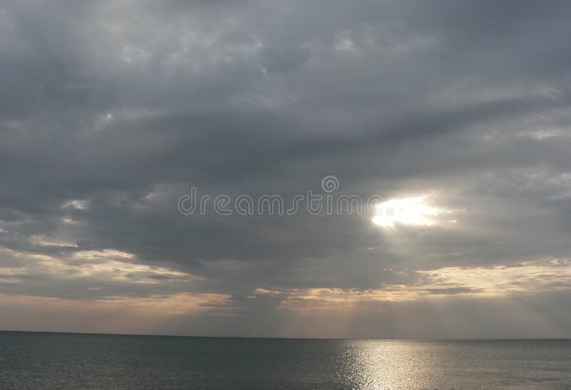 Sunset on Sea with Grey Cloudy Sky, Rays of Light Stock Photo - Image ...