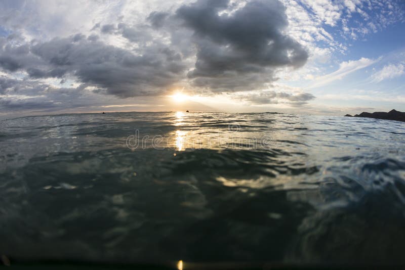 Sunset at Sea Level stock image. Image of surface, coast - 43864669