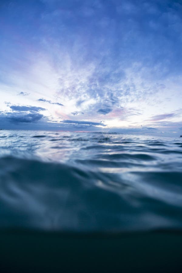 Sunset at Sea Level stock image. Image of cloudscape - 43864677