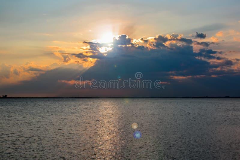 Sunset at Sea, the Rays of the Sun Make Their Way through Heavy Clouds ...