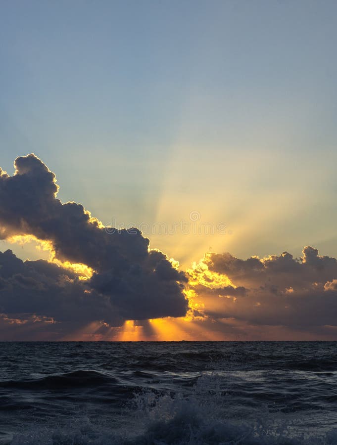 Sunset at the Sea. Sun Beams through the Clouds Stock Photo - Image of ...