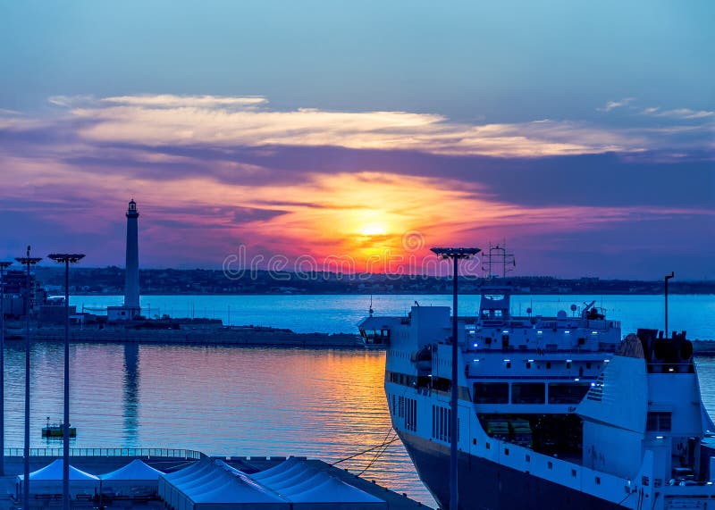 Sunset at sea trading port stock image. Image of maritime - 142060137