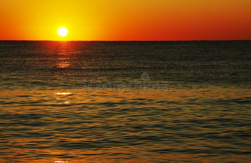 Sun Setting Behind Sea Horizon Stock Photo - Image of water, sets: 7802608