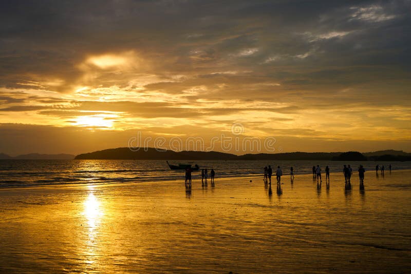 Sunset on the Seashore.People are Looking for Beautiful Shells on the ...